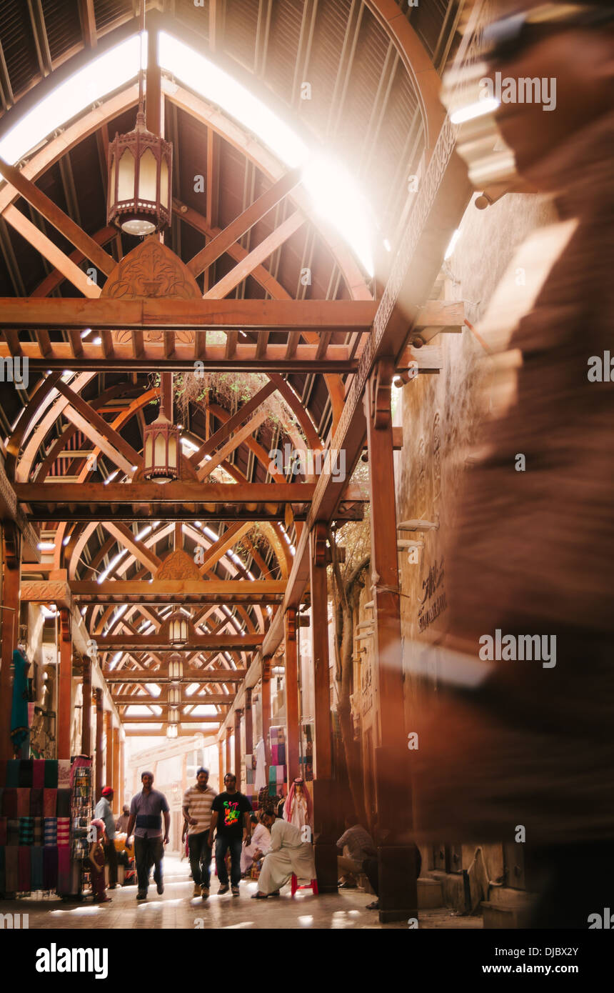 Arab men strolling down the covered Bur Dubai Souk. Dubai, United Arab ...