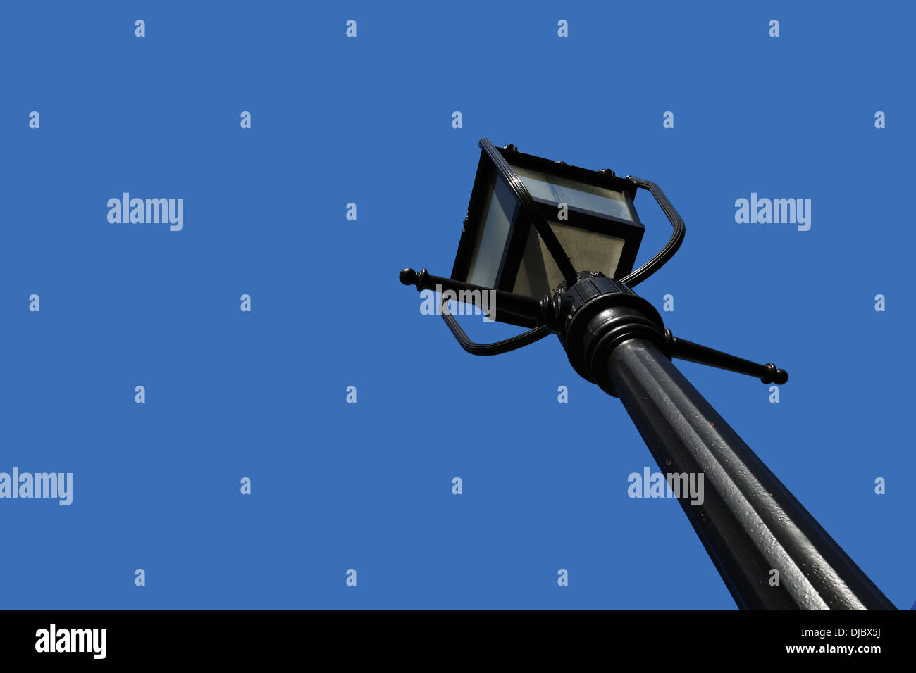 turn of a century lamp post on a clear blue sky Stock Photo - Alamy