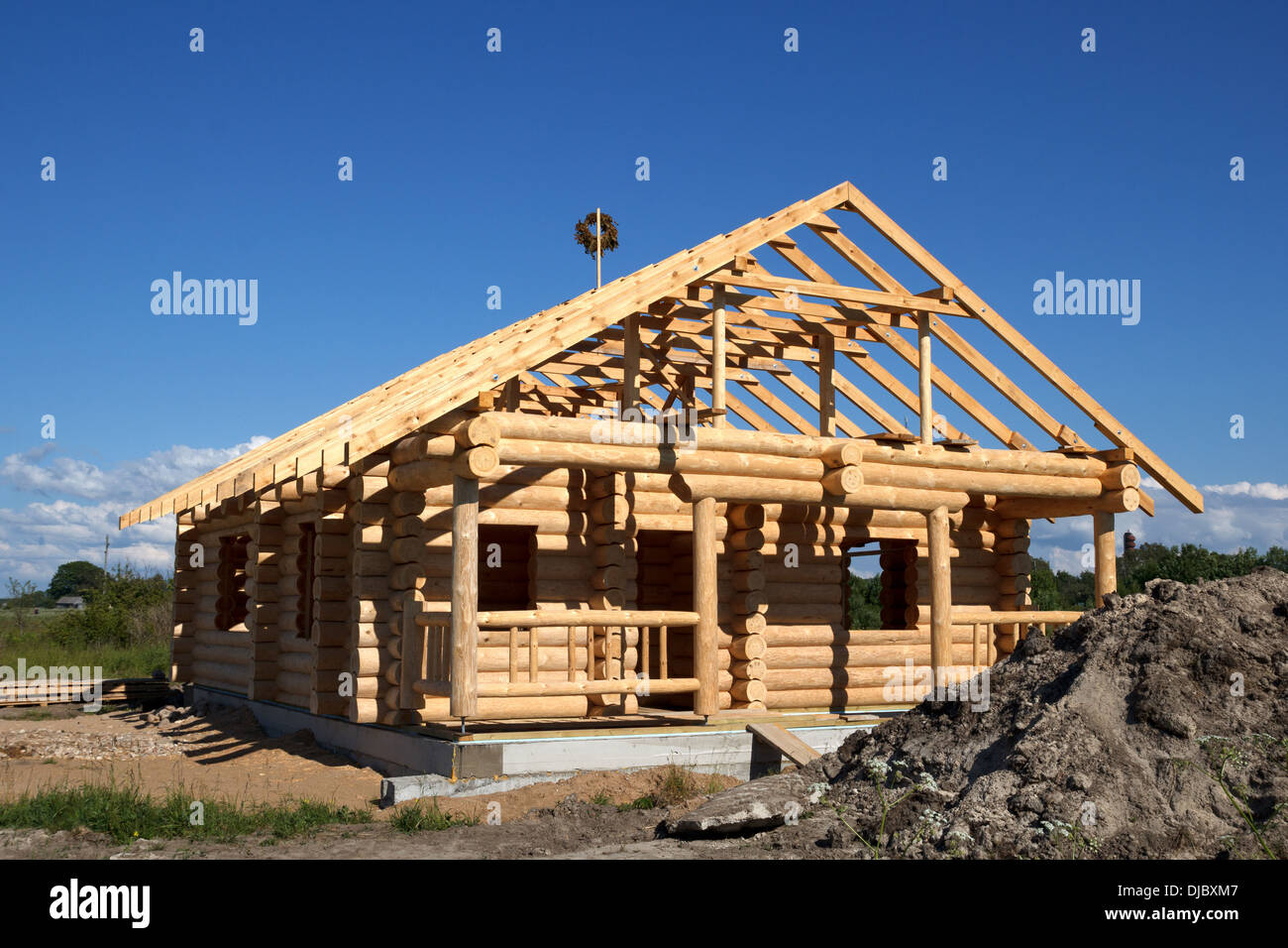 new house built from logs against blue sky Stock Photo - Alamy