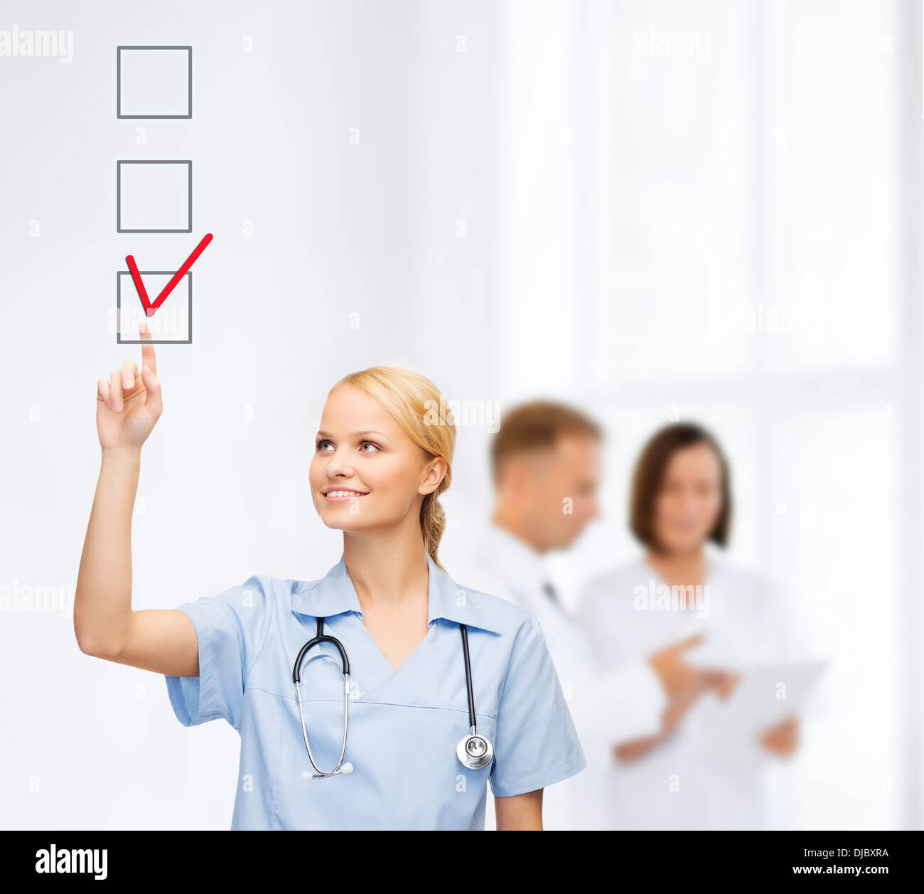 doctor or nurse drawning checkmark into checkbox Stock Photo - Alamy