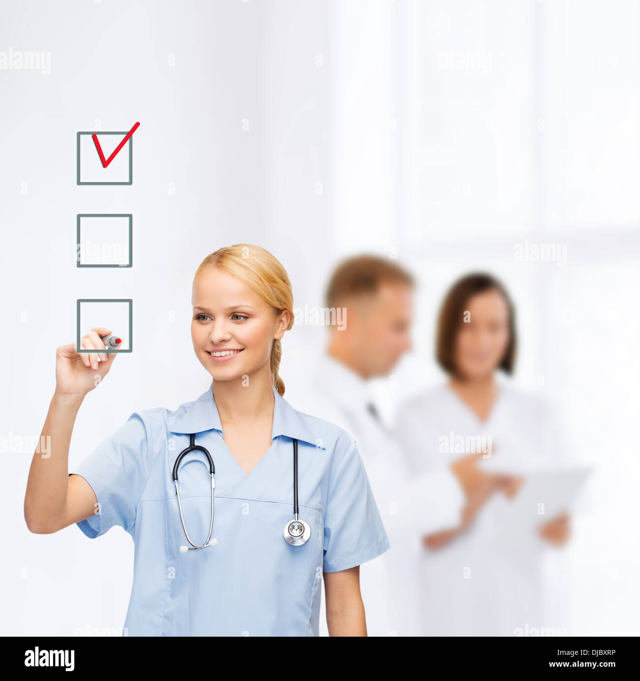 doctor or nurse drawing checkmark into checkbox Stock Photo - Alamy