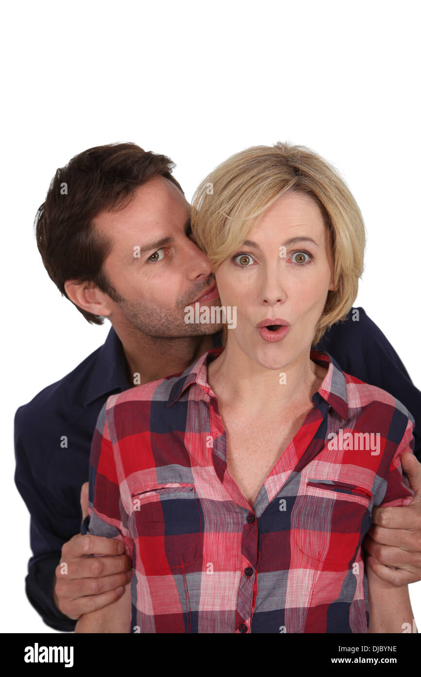 Man surprising woman Stock Photo - Alamy