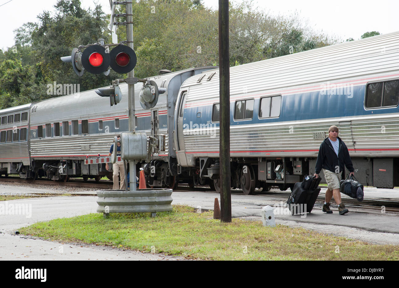 Amtrak passenger train passing level crossing at DeLand Florida USA ...