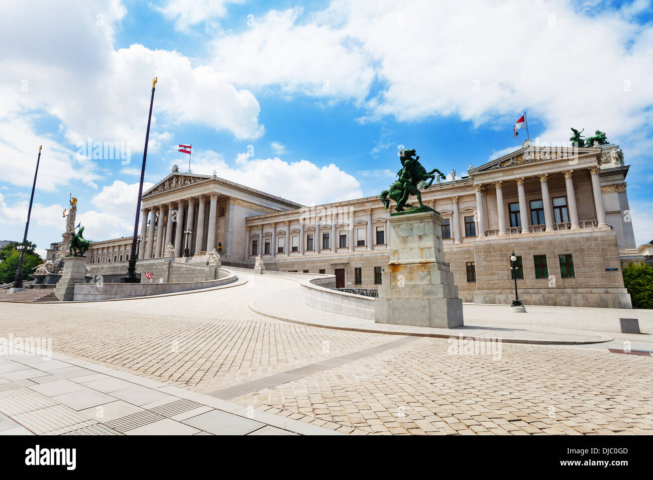 Austrian Parliament Building and statue on one of downtown squares ...