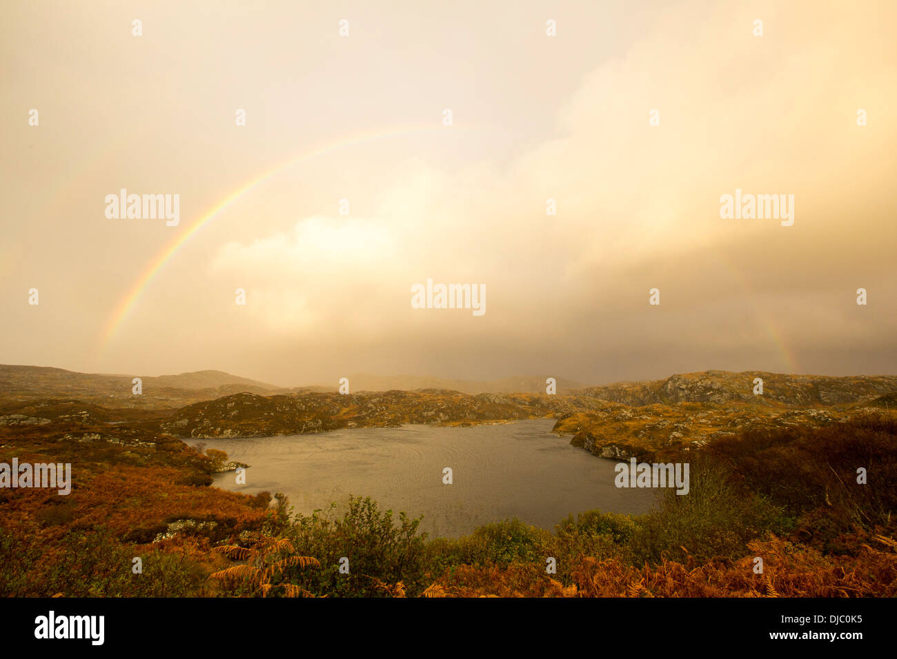 A rainbow over moorland in Assynt near Achmelvich, North West Highlands ...