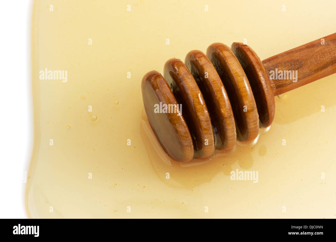 honey and stick isolated on white background Stock Photo - Alamy