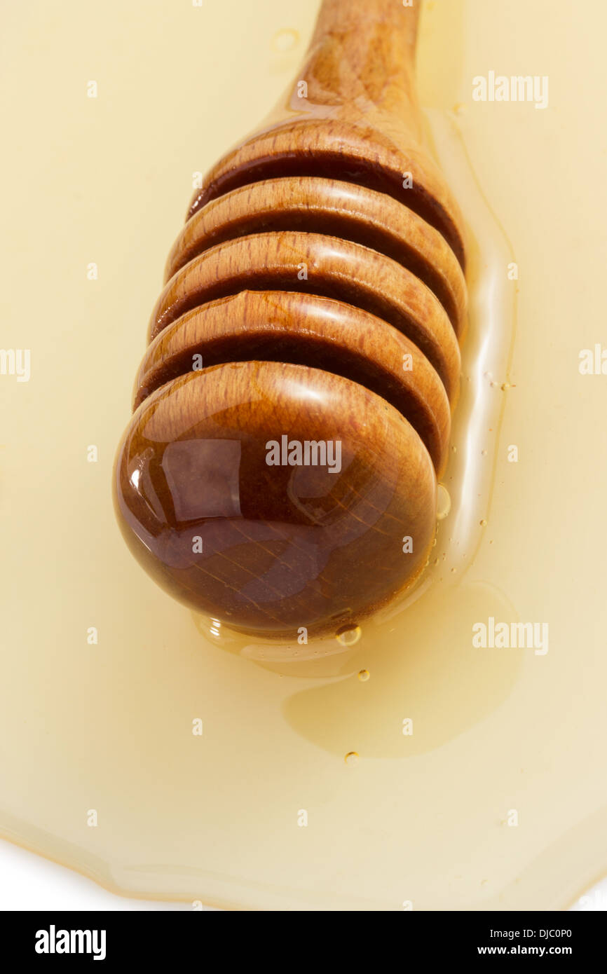 honey and stick isolated on white background Stock Photo - Alamy
