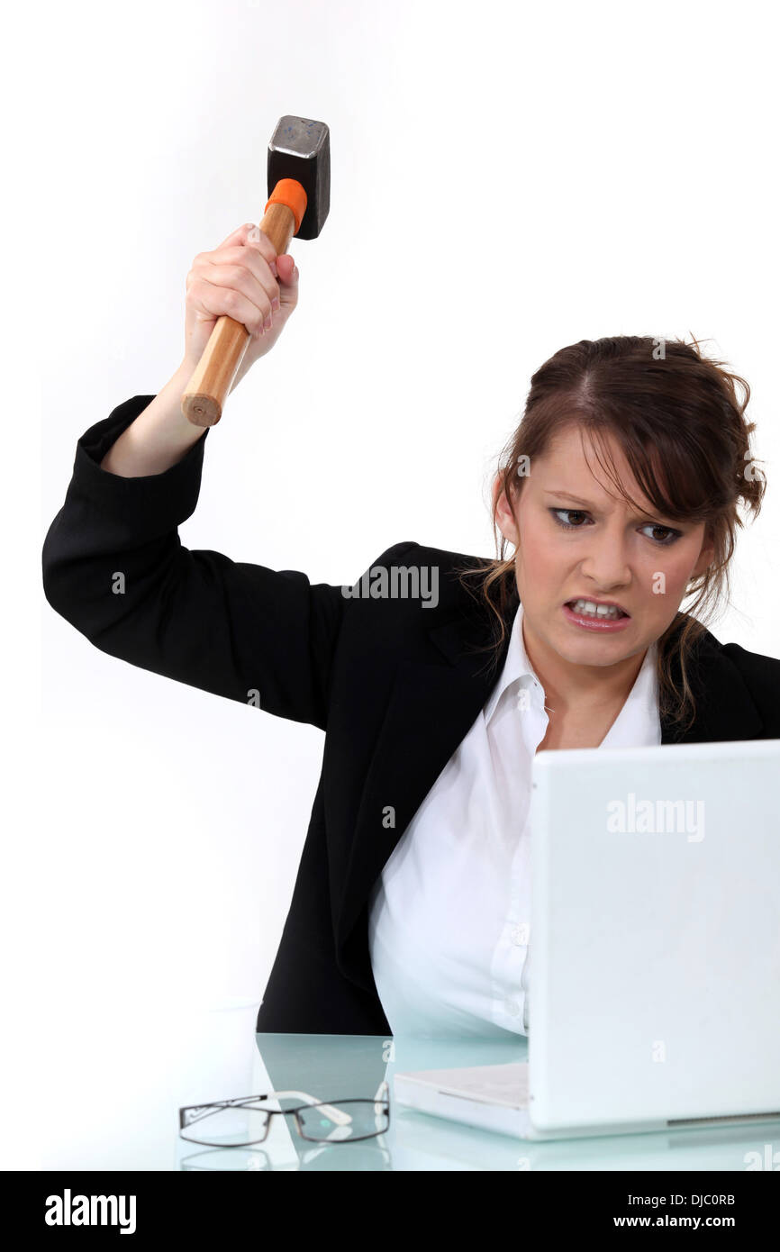 Corporate woman mad at her laptop Stock Photo - Alamy