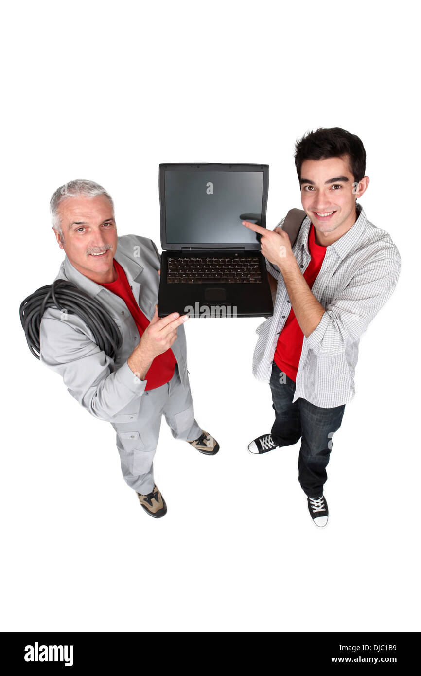 Men embracing technology Stock Photo - Alamy