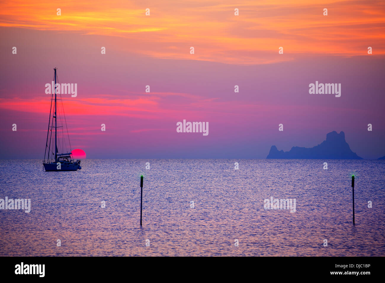 Ibiza sunset sun view from formentera Island with sailboat in Balearic ...