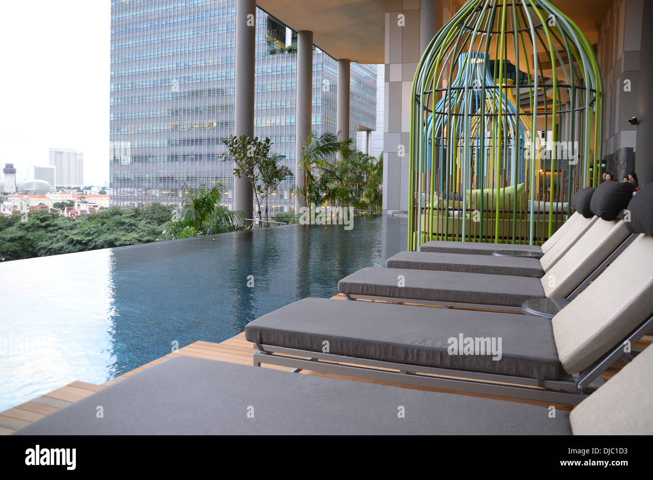 Poolside lounge chairs Stock Photo - Alamy