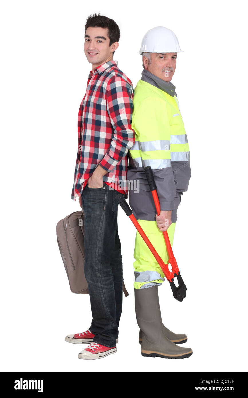 Teenage apprentice stood with master Stock Photo - Alamy