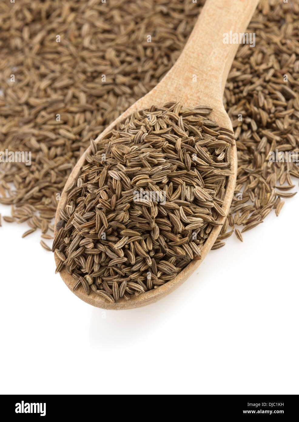 cumin seeds in spoon isolated on white background Stock Photo - Alamy