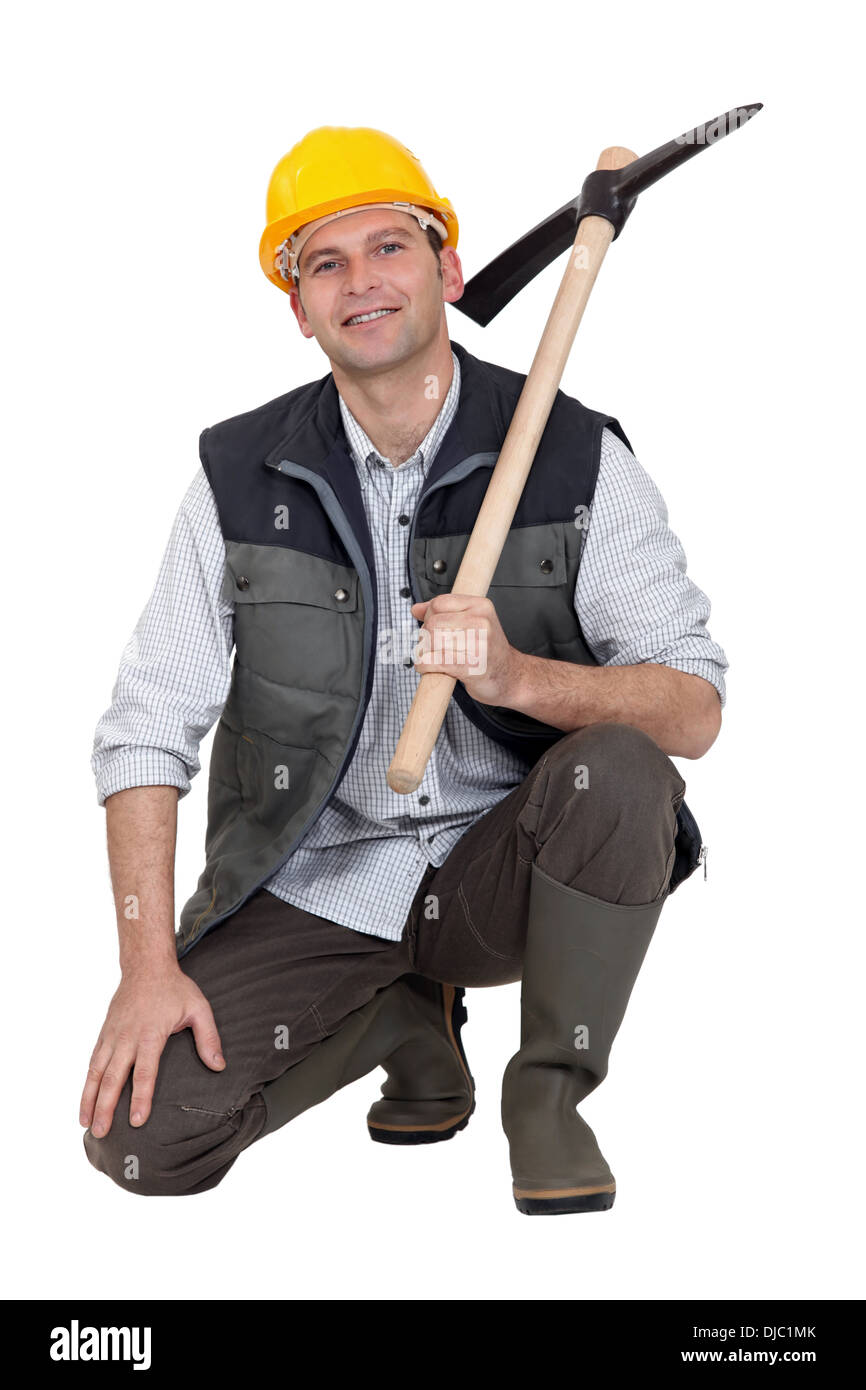 Construction worker with a pickaxe Stock Photo - Alamy