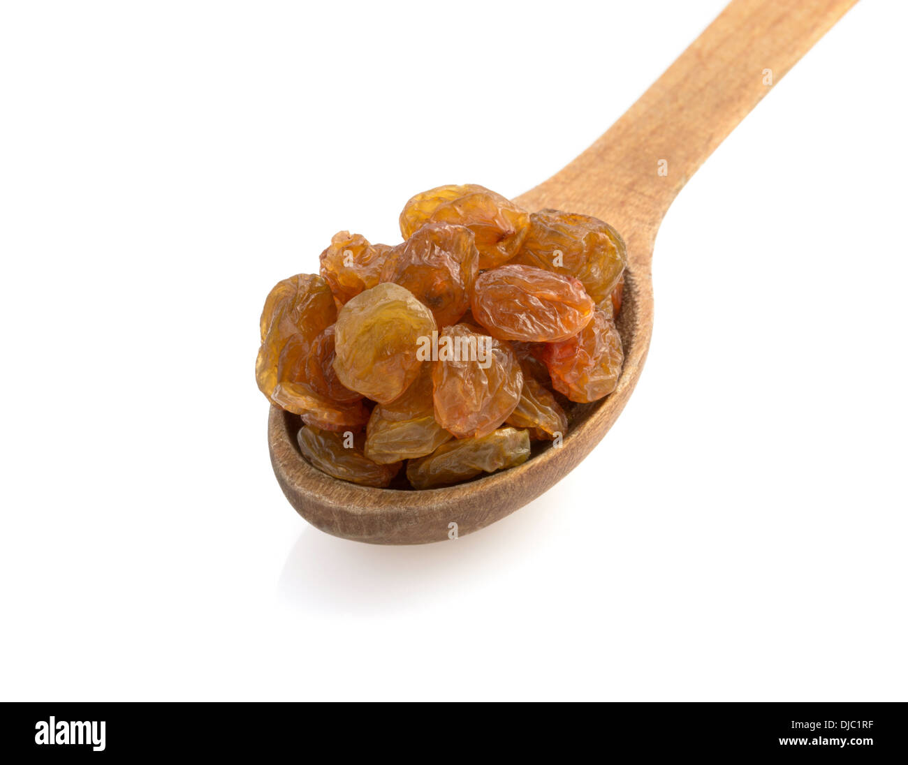 raisins in spoon isolated on white background Stock Photo - Alamy
