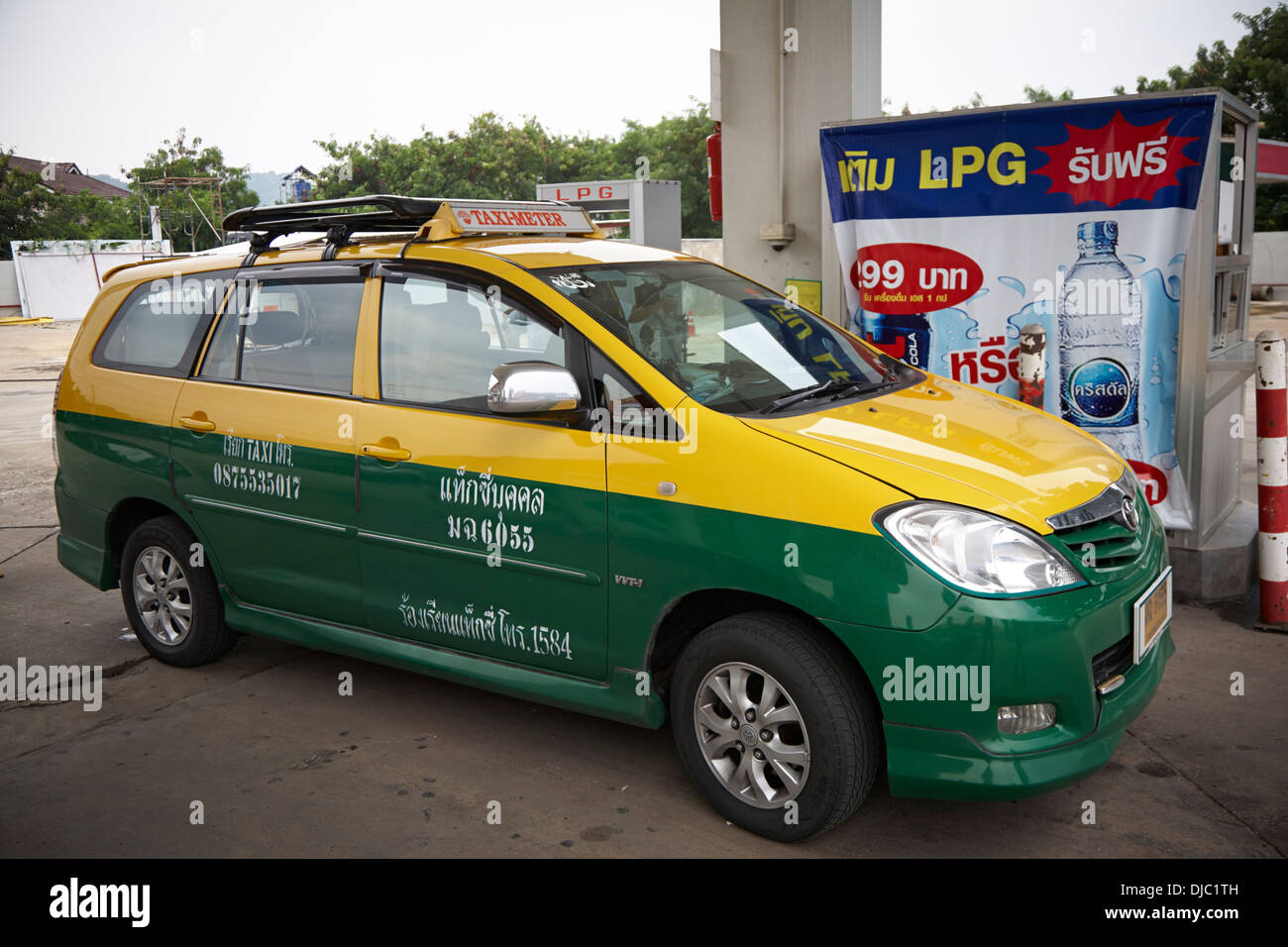 LPG Taxi filling up with LPG Gas in a filling station parked on a ...