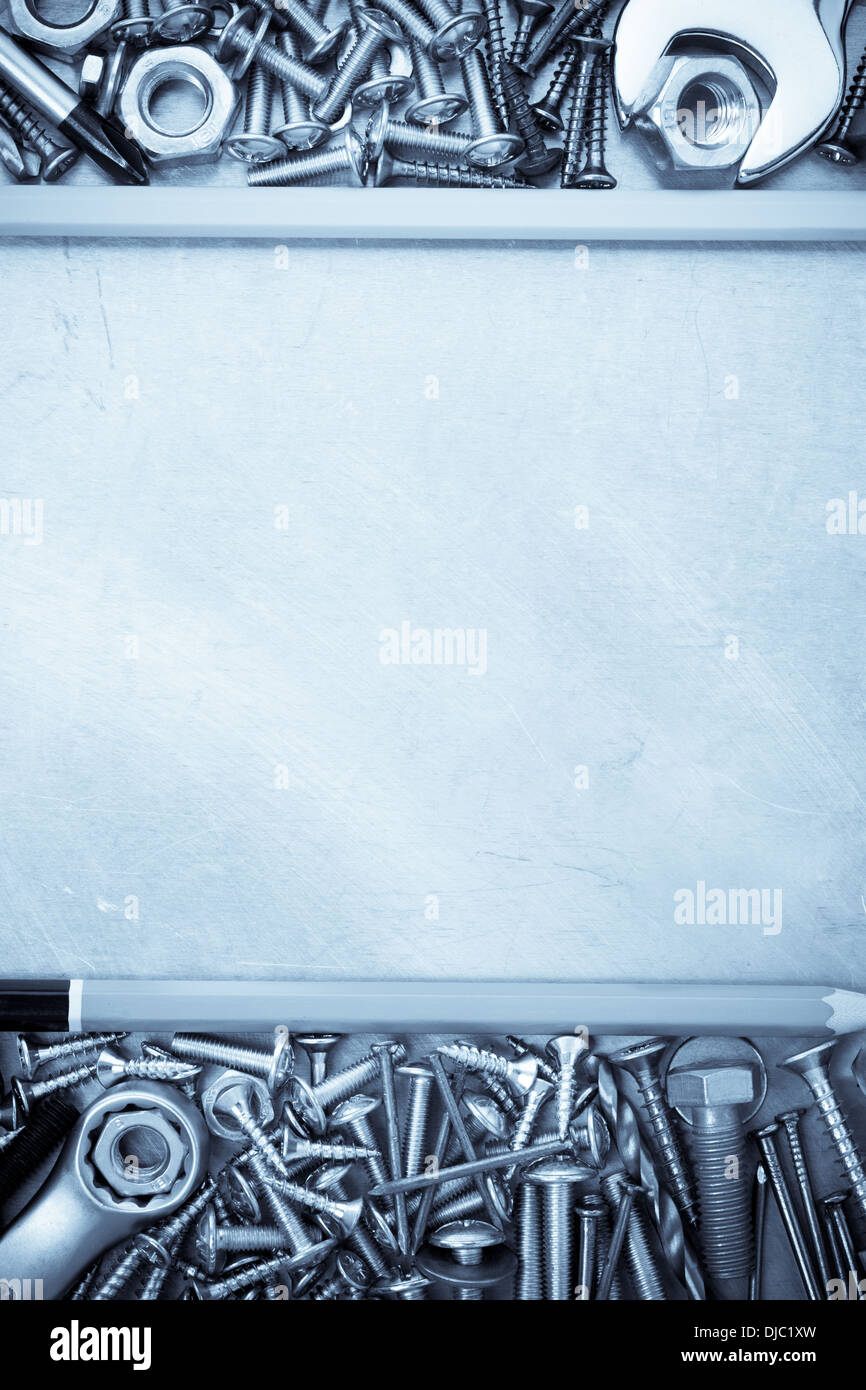 metal construction hardware tool on metal texture Stock Photo - Alamy