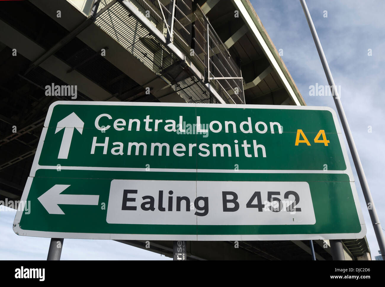 british road sign giving directions to hammersmith and central london ...
