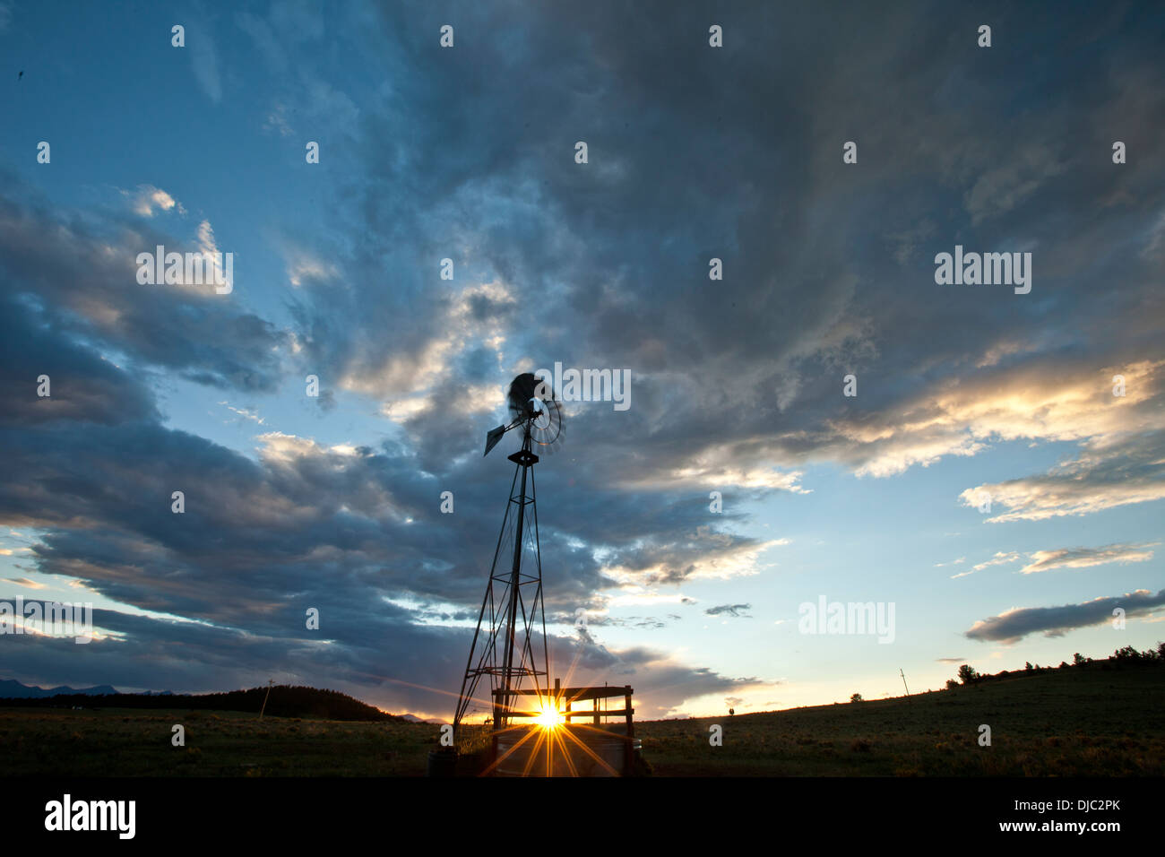 Windmill on the Open Range Stock Photo - Alamy