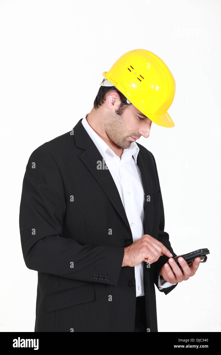 Man with helmet and cell phone Stock Photo - Alamy