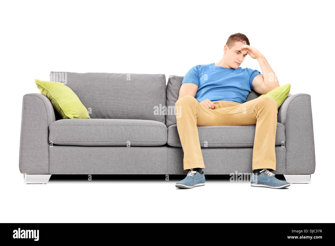 Sitting on sofa young Cut Out Stock Images & Pictures - Alamy
