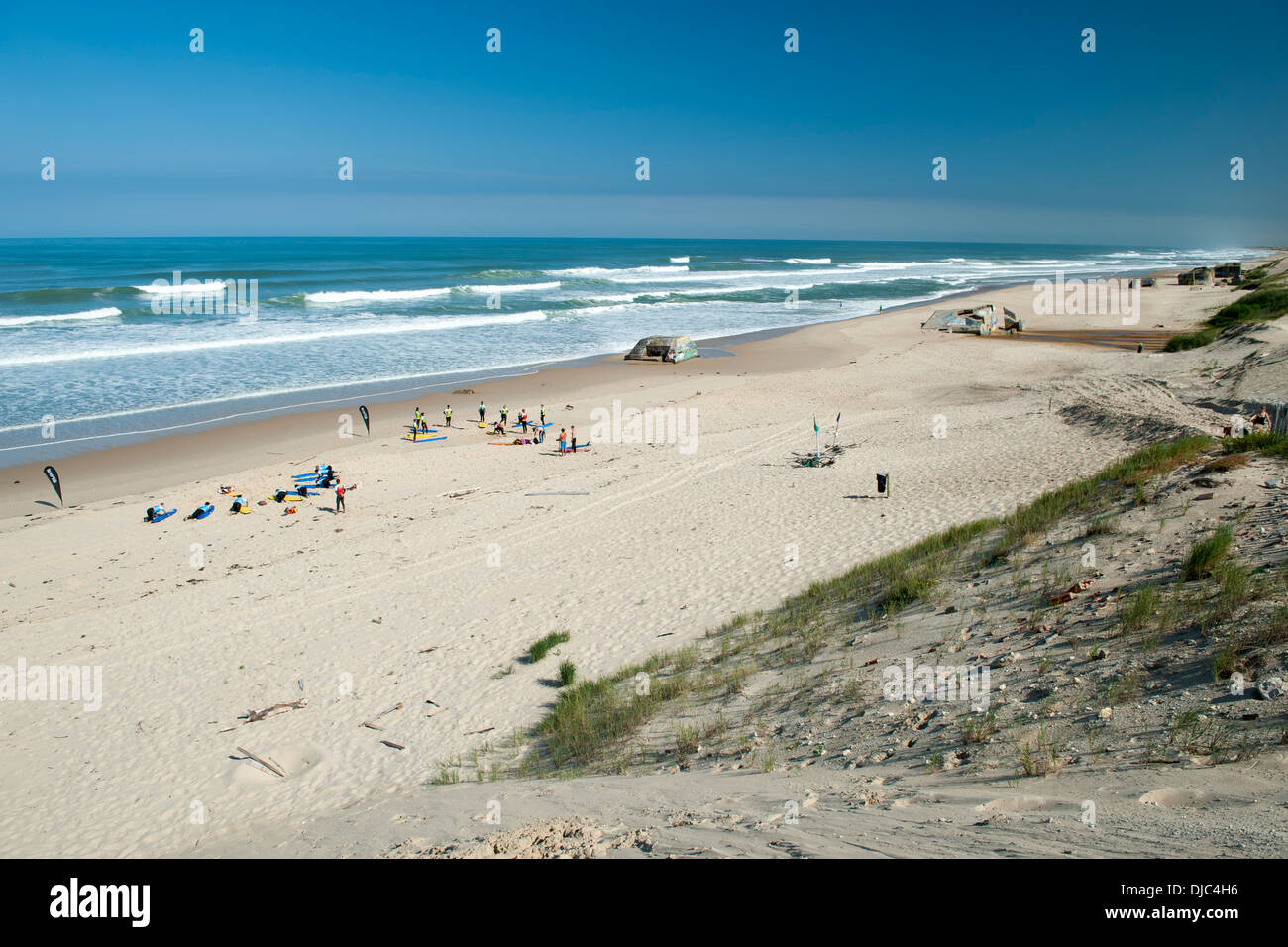 Surfers and the remains of world war II blockhouses on Le Pin Sec beach ...