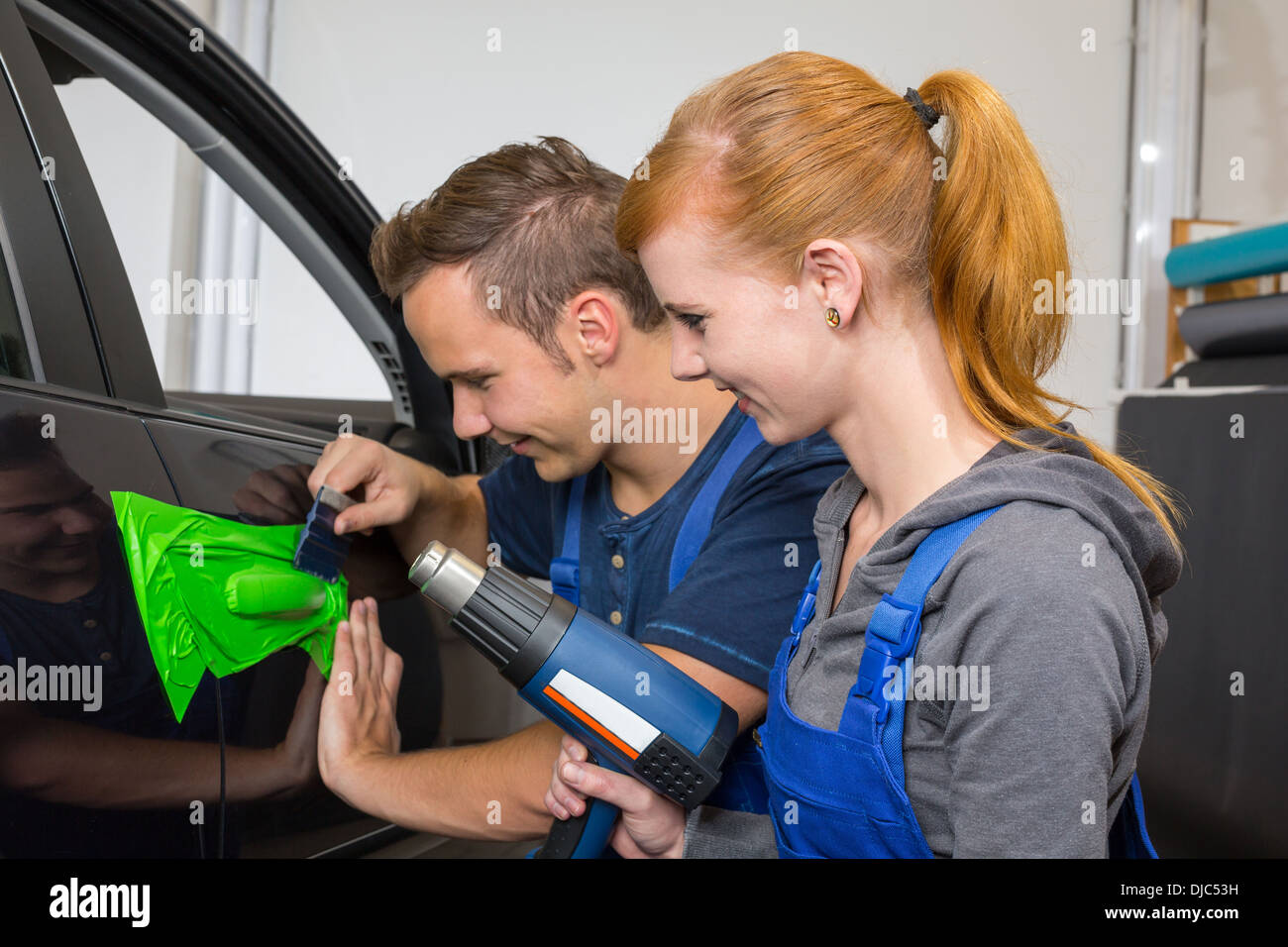 car wrapping professional wrapping car door handle in colorful foil or ...