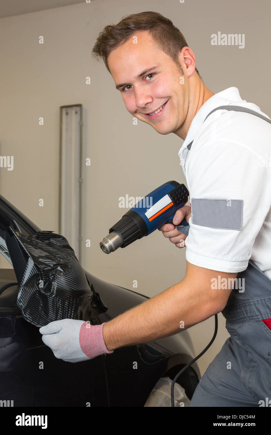 Car mirror wrapped in adhesive foil or film by car wrapping ...