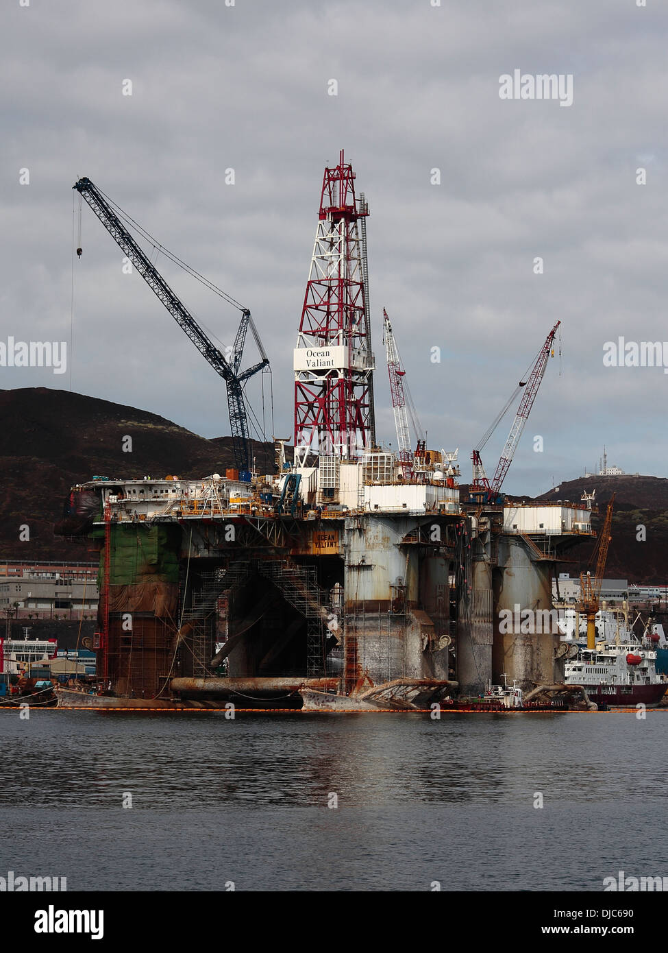 The drilling rig Ocean Valiant, undergoing repairs, in a boatyard Stock ...