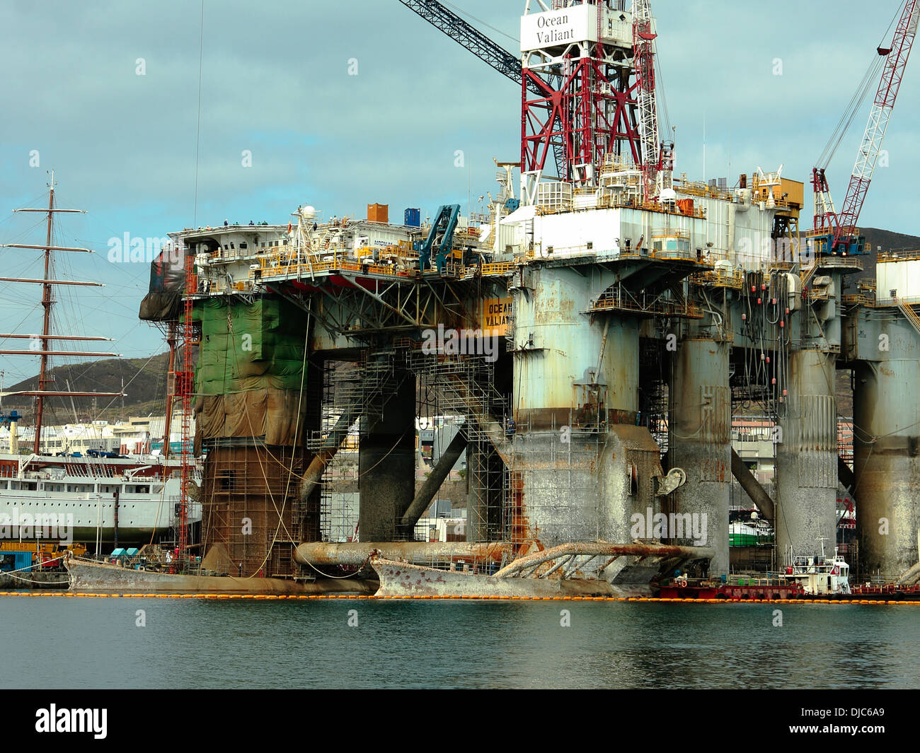 The drilling rig Ocean Valiant, undergoing repairs, in a boatyard Stock ...