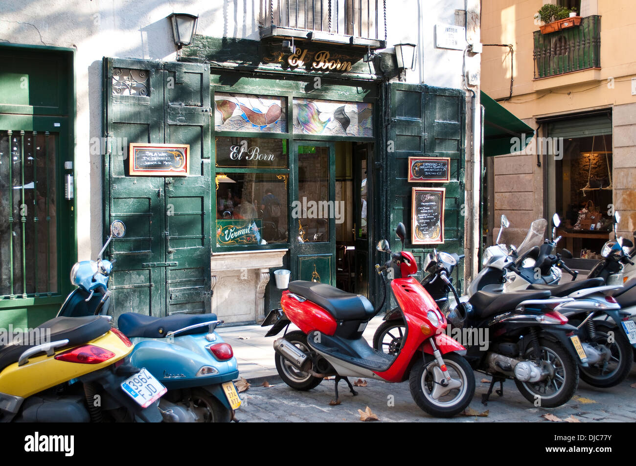 El Born bar with scooters in front of it in Passeig del Born, Barcelona ...