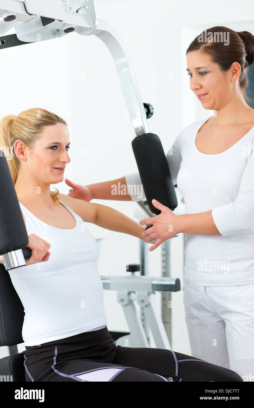Patient at the physiotherapy making physical exercises with her ...