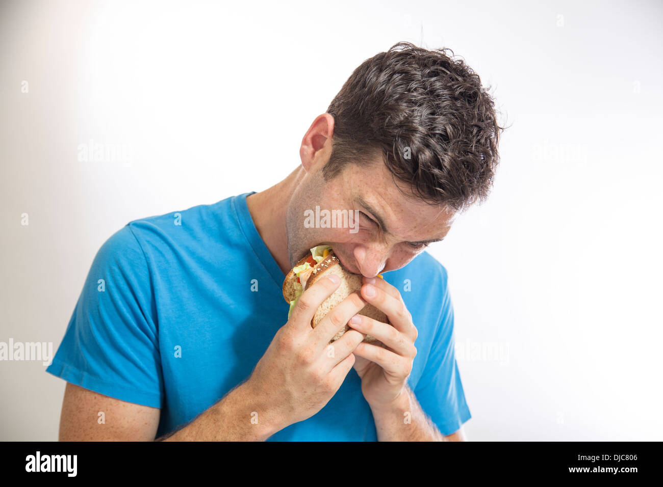 Man biting into a sandwich Stock Photo: 62964614 - Alamy Man biting into a sandwich Stock Photo: 62964614 - Alamy