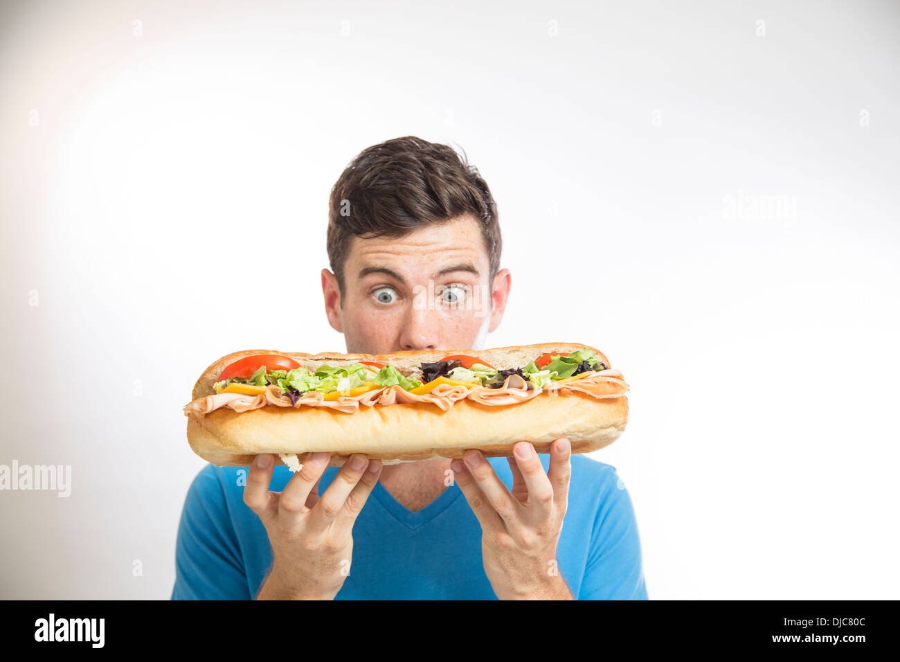 Man eating meat sandwich hi-res stock photography and images - Alamy