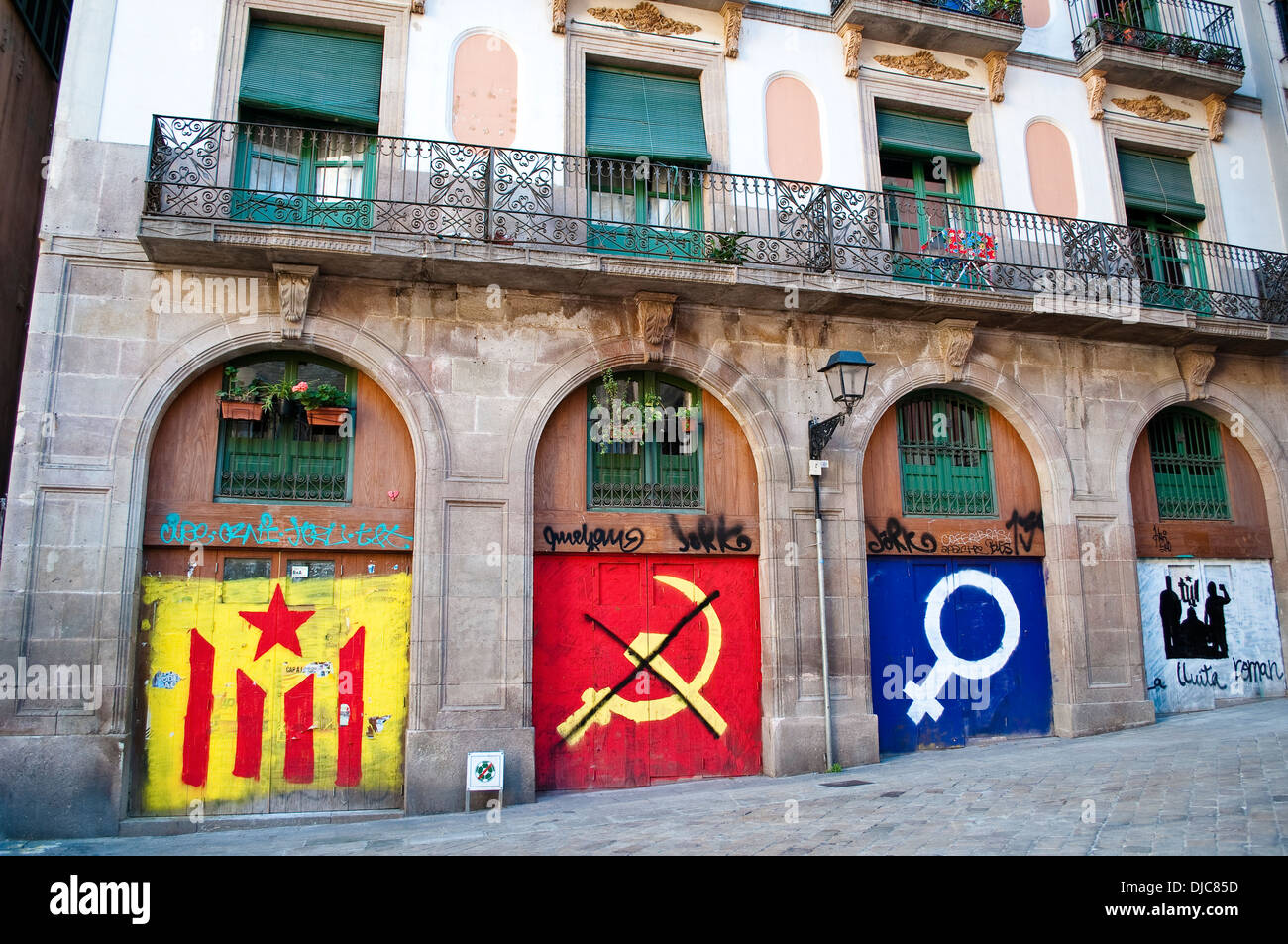 Communist feminist and Catalan symbols painted on house in Placa del ...