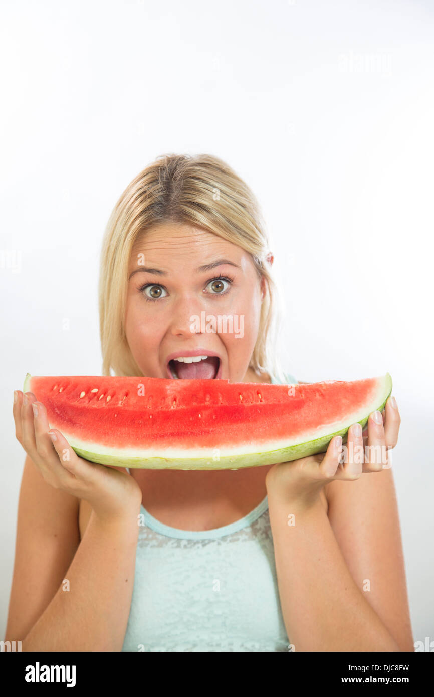 Woman eating watermelon hi-res stock photography and images - Alamy