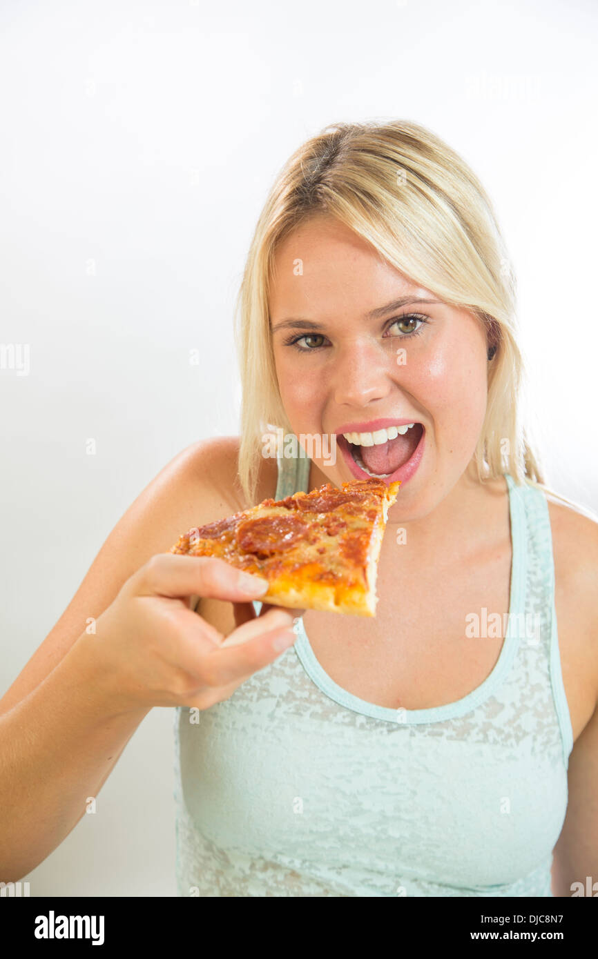 Woman eating pizza hi-res stock photography and images - Alamy