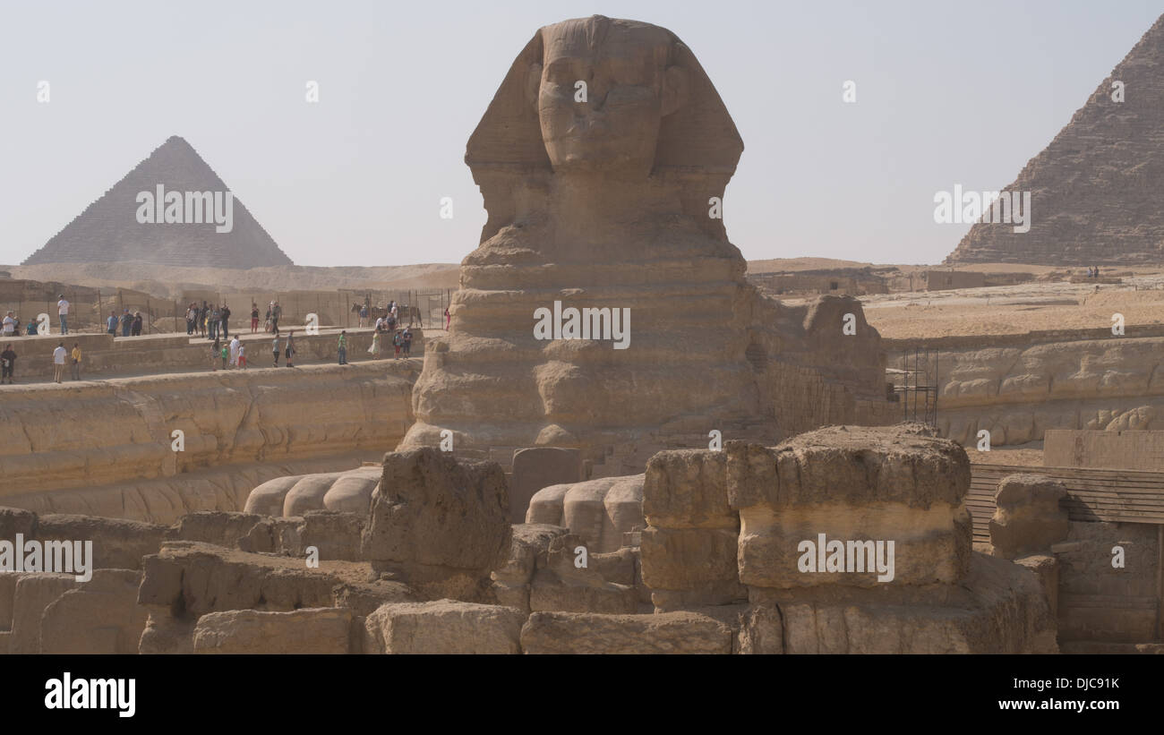 The Great Sphinx of Giza, with two of the pyramids behind, Egypt Stock ...