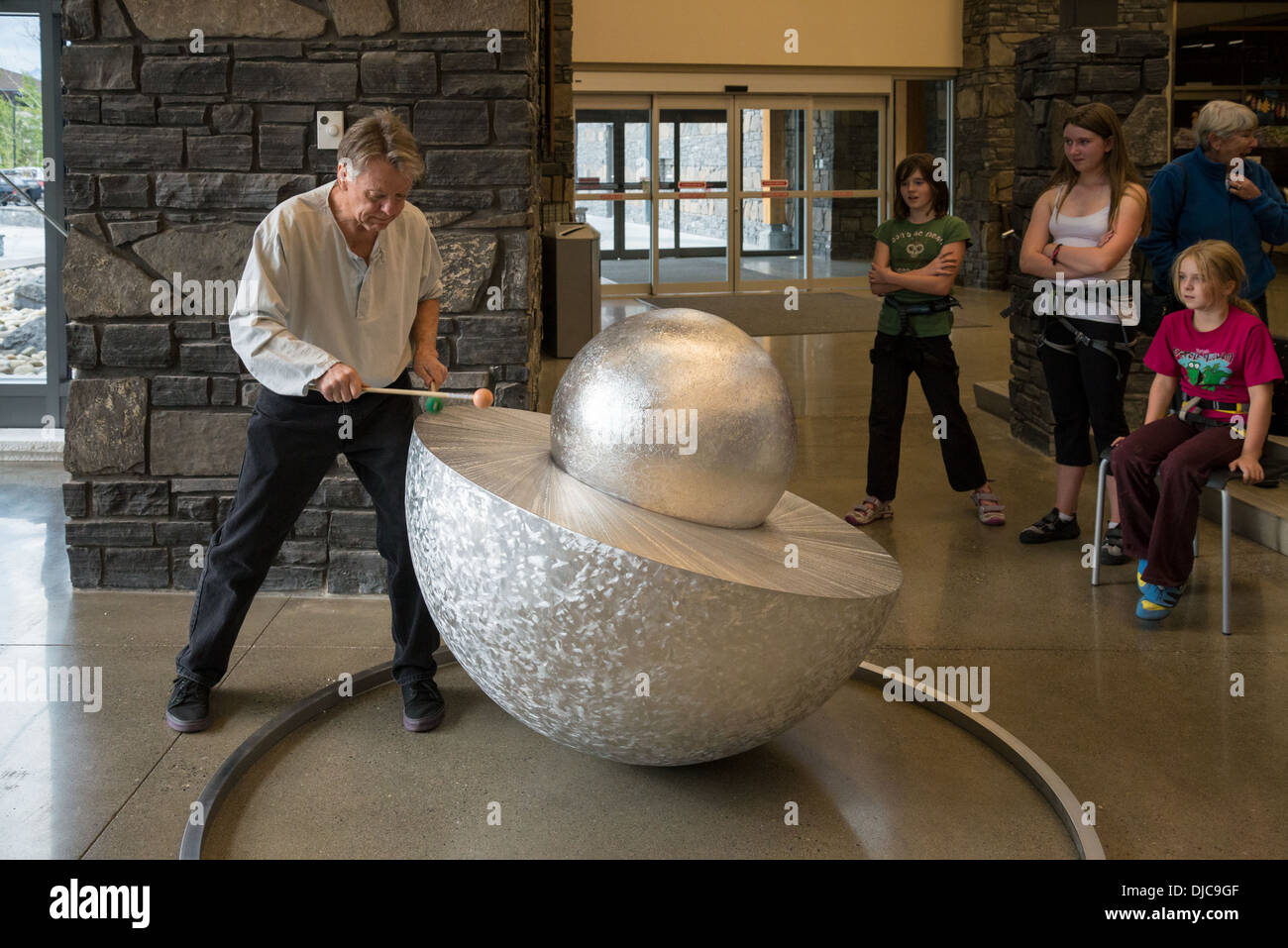 Sculptor Tony Bloom plays metal drum sculpture at artspeak, Elevation ...