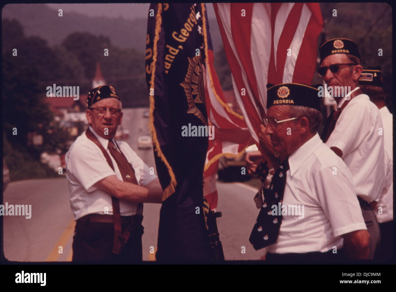 This image captures a moment from an American Legion parade, showcasing ...