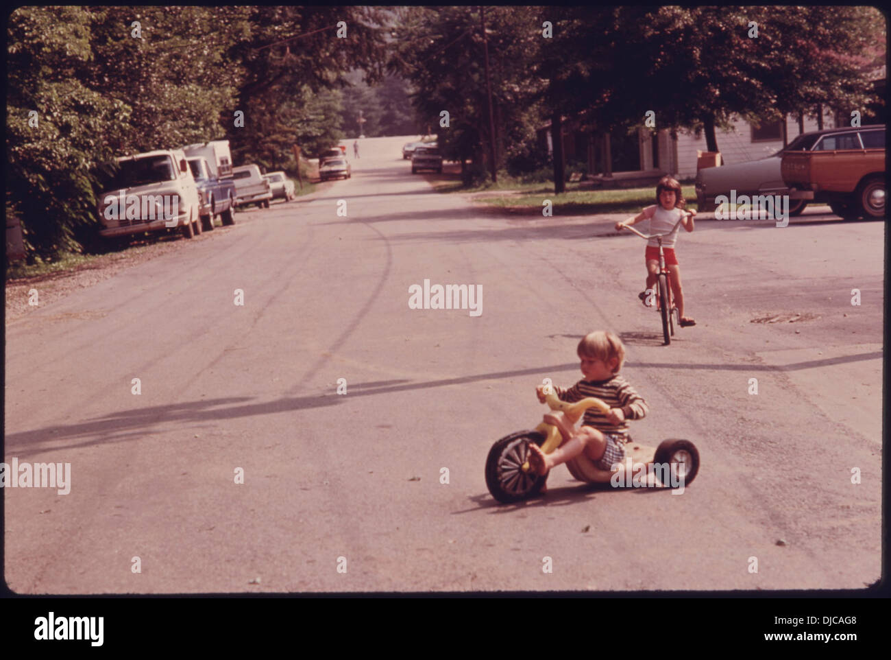 Children of Calvin Garrett are playing in the street in front of their ...