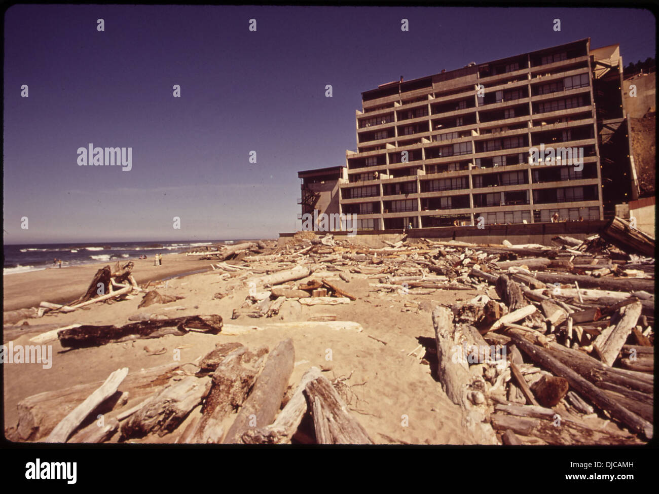 This photograph shows a condominium located on the beach, highlighting ...