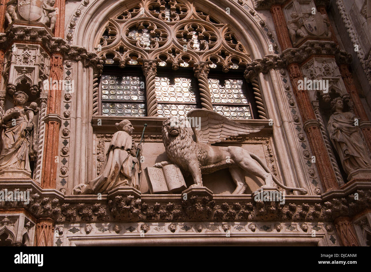 Statue of the Venetian Lion and the Doge on the side of St Marks ...