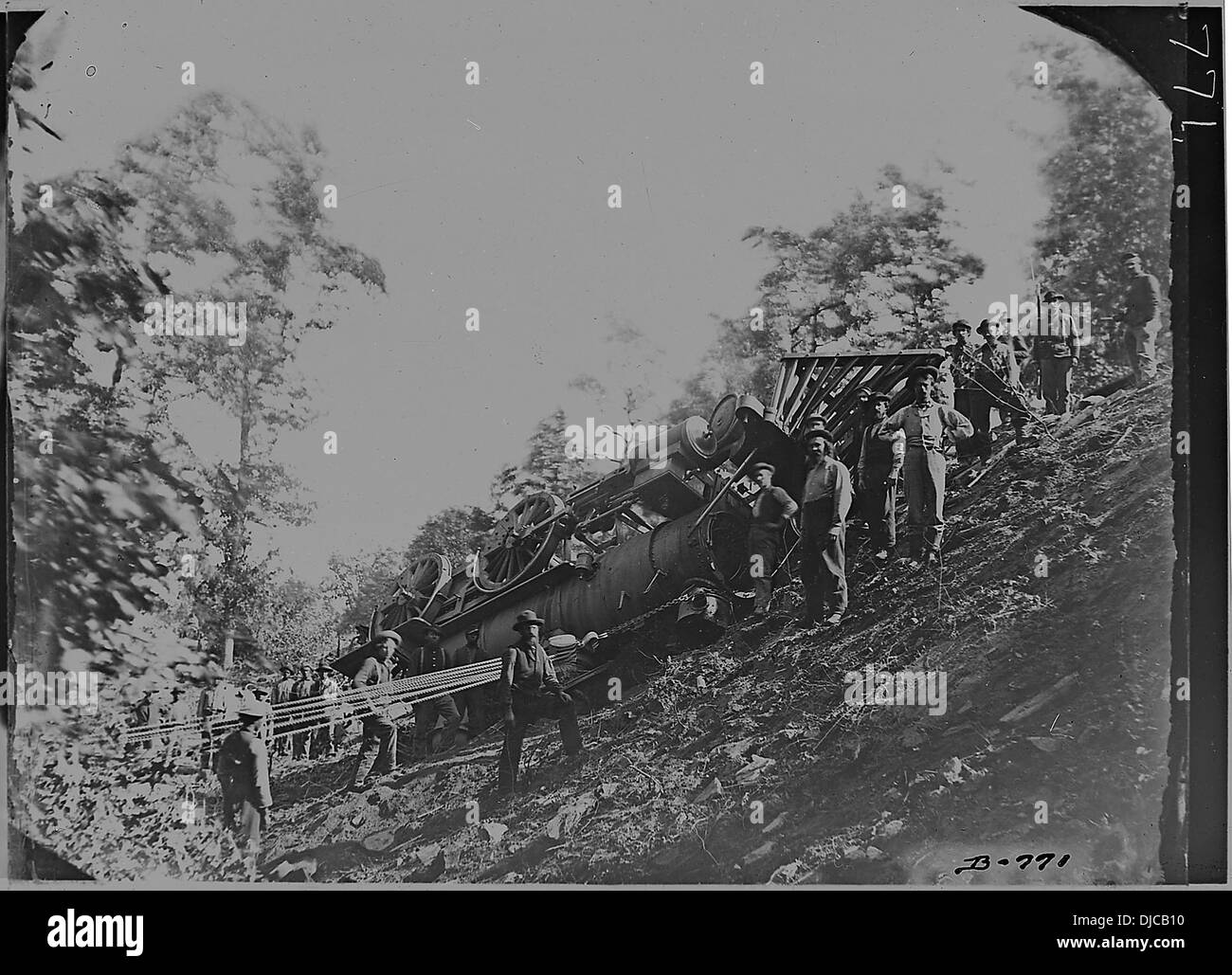 An engine has been thrown over an embankment, and efforts are underway ...