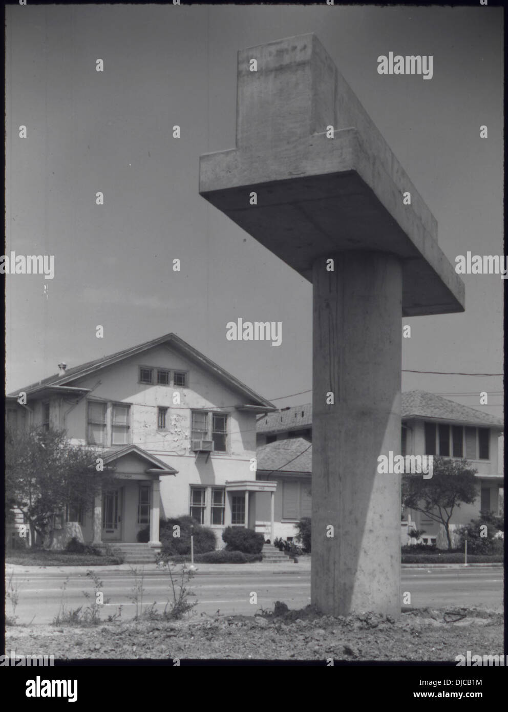 A black-and-white photograph showing an expressway pillar in Houston ...