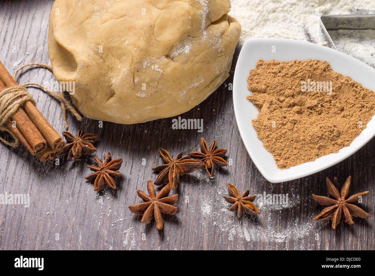 Dough and flour with spices on board Stock Photo - Alamy