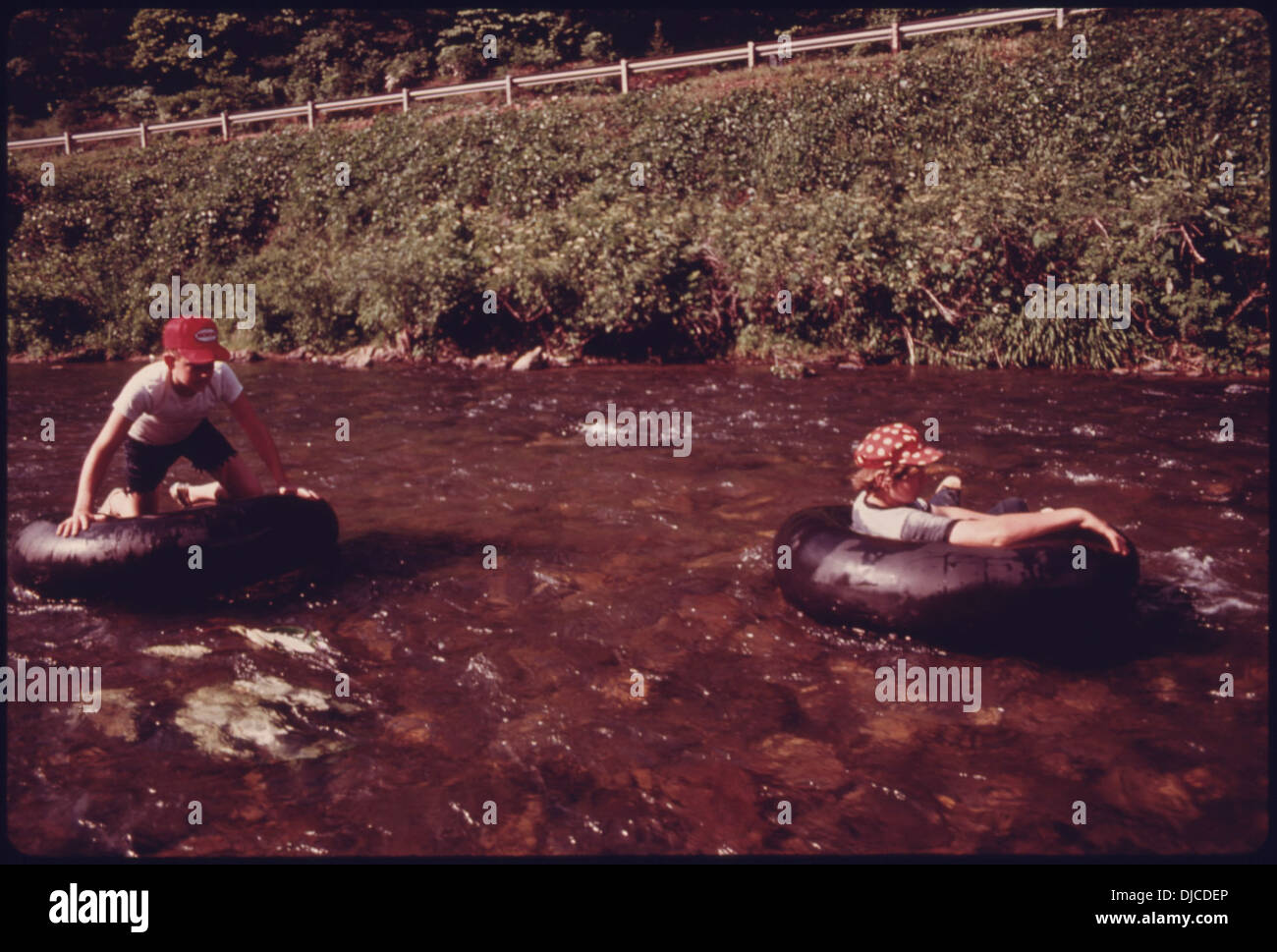 TWO YOUTHS ON TRUCK INNER TUBES FLOATING DOWN THE CHATTAHOOCHEE RIVER ...