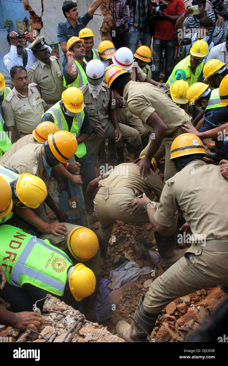 Bangalore, India. 26th Nov, 2013. Indian firemen take out a seriously ...