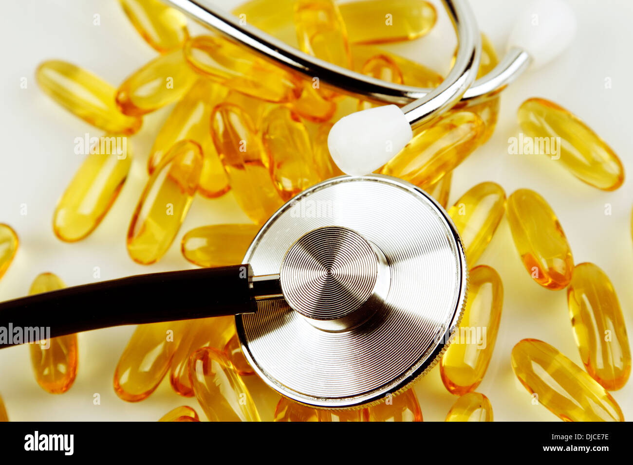 Closeup of stethoscope on fish oil capsules Stock Photo - Alamy