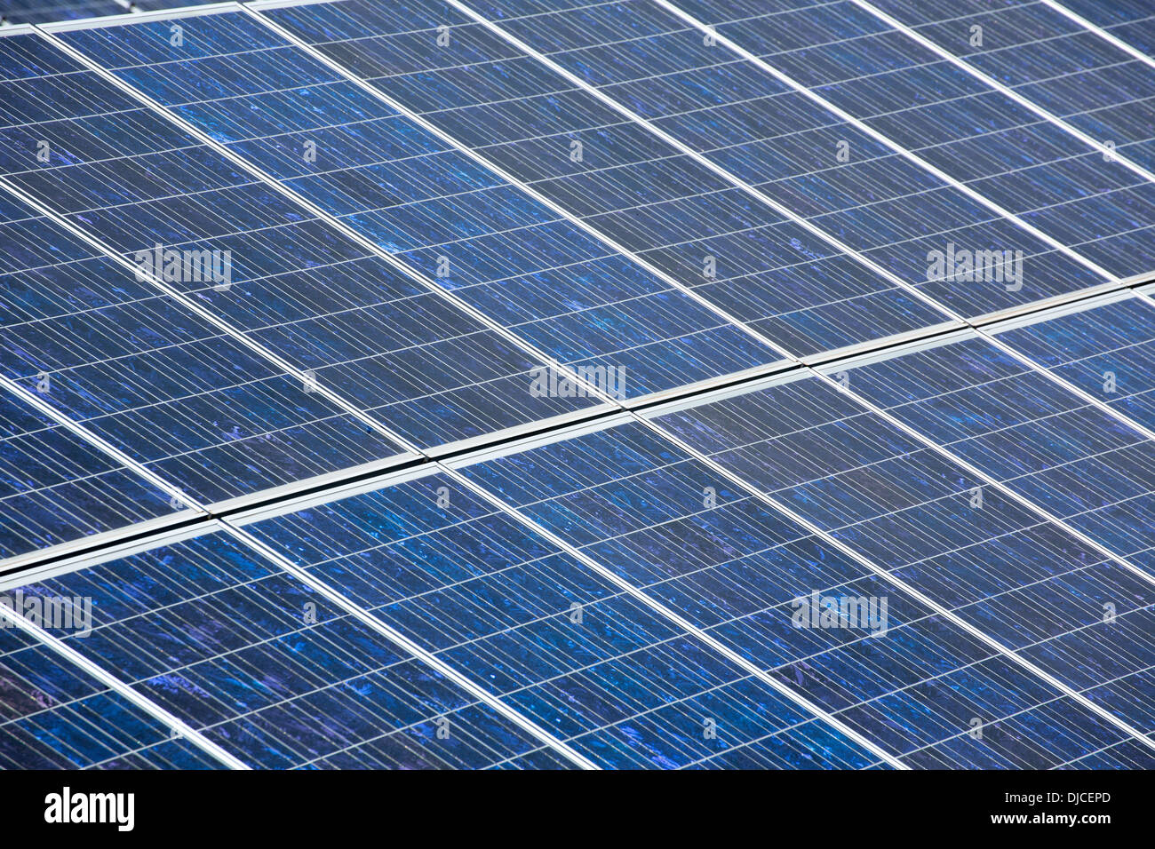 Solar plates for green sun energy in a row Stock Photo - Alamy